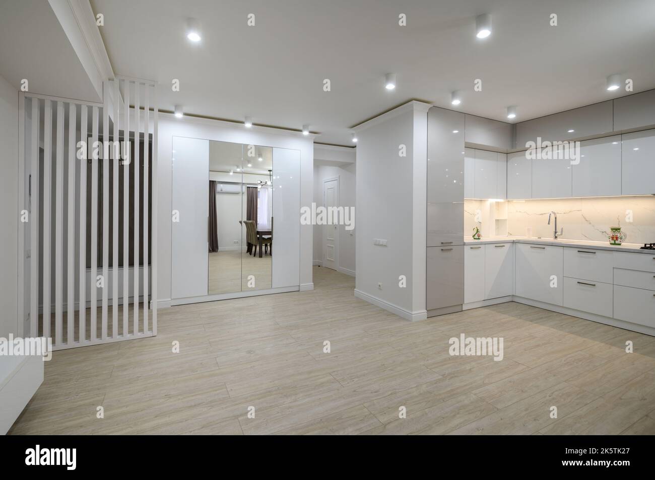 Large white room connected to hall and kitchen in a studio flat Stock ...
