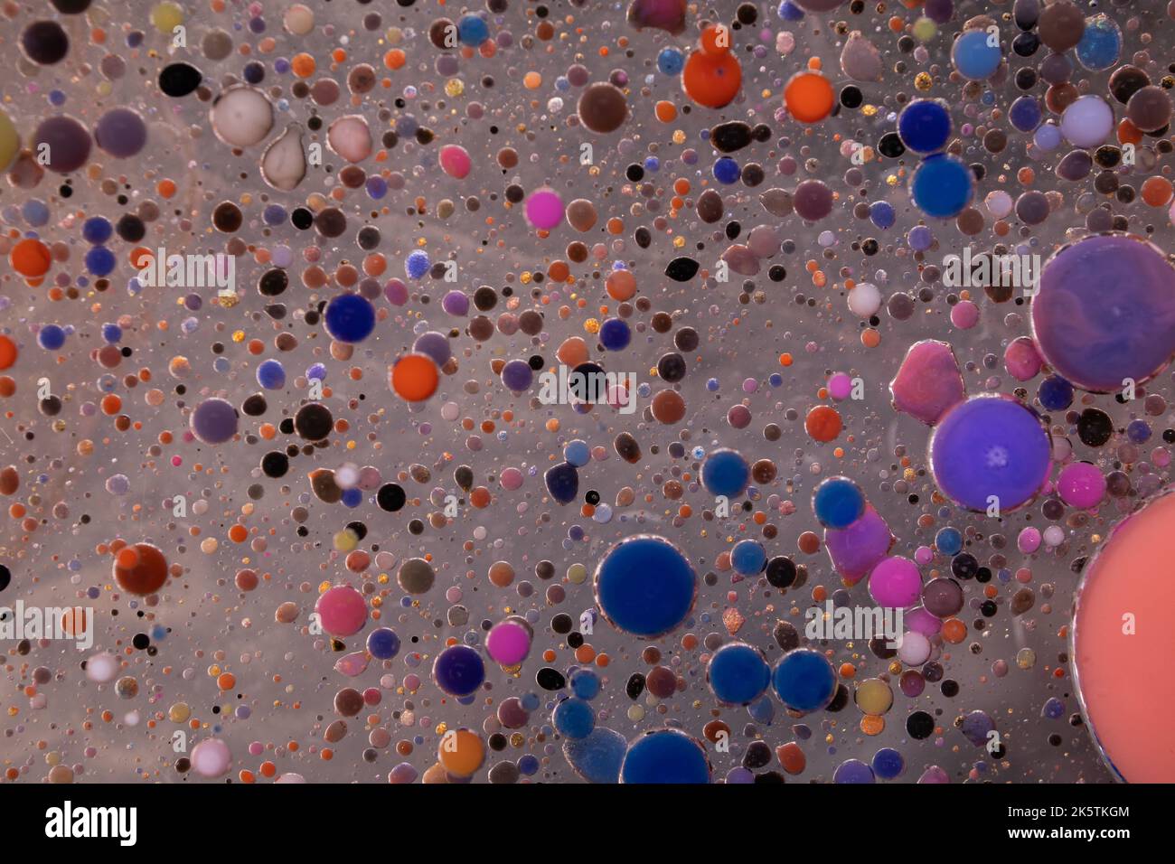 Acrylic paint balls abstract texture. Bright colors fluid, flowing ...