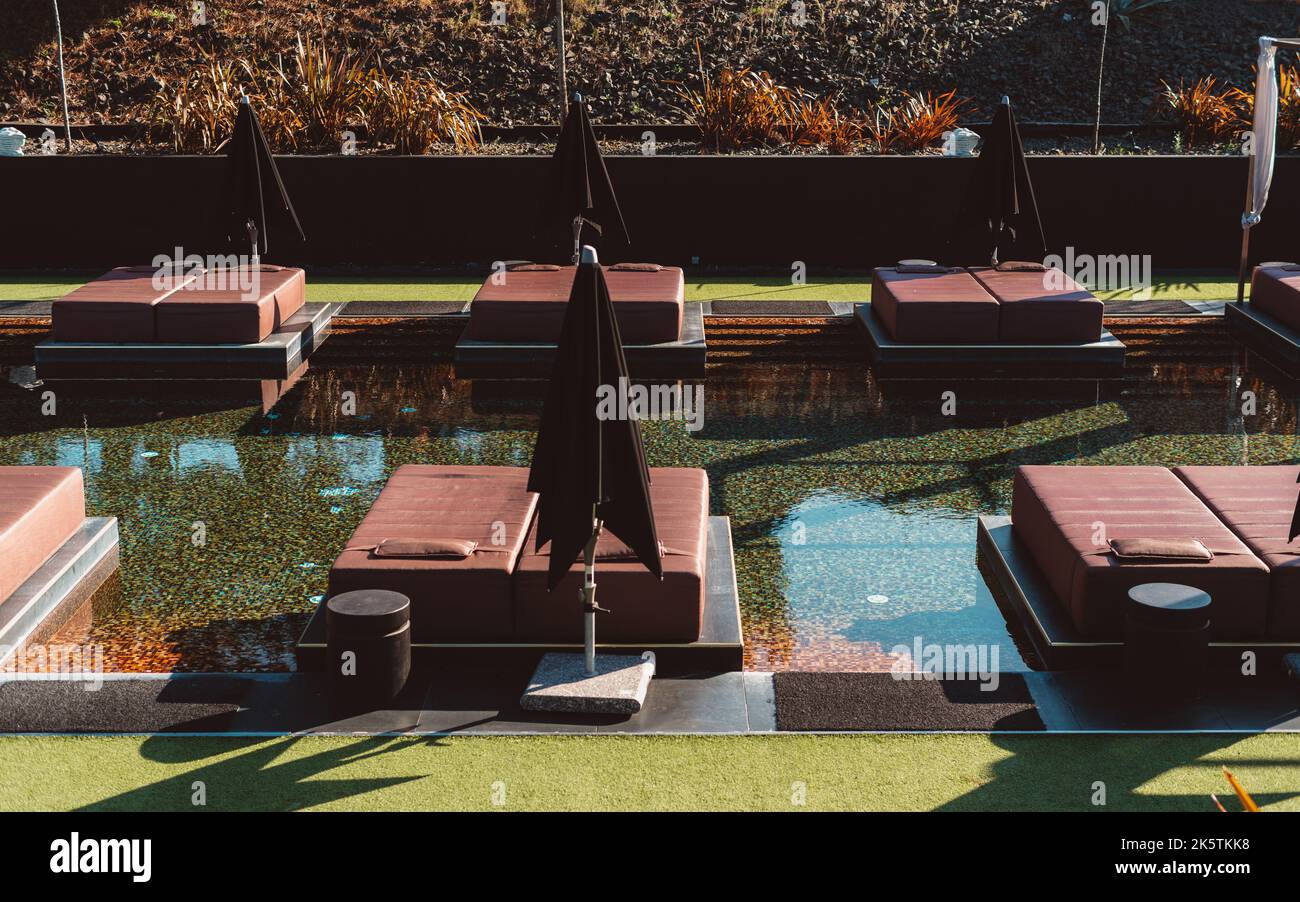 View of a shallow recreational swimming pool with a tiled bottom, with ...
