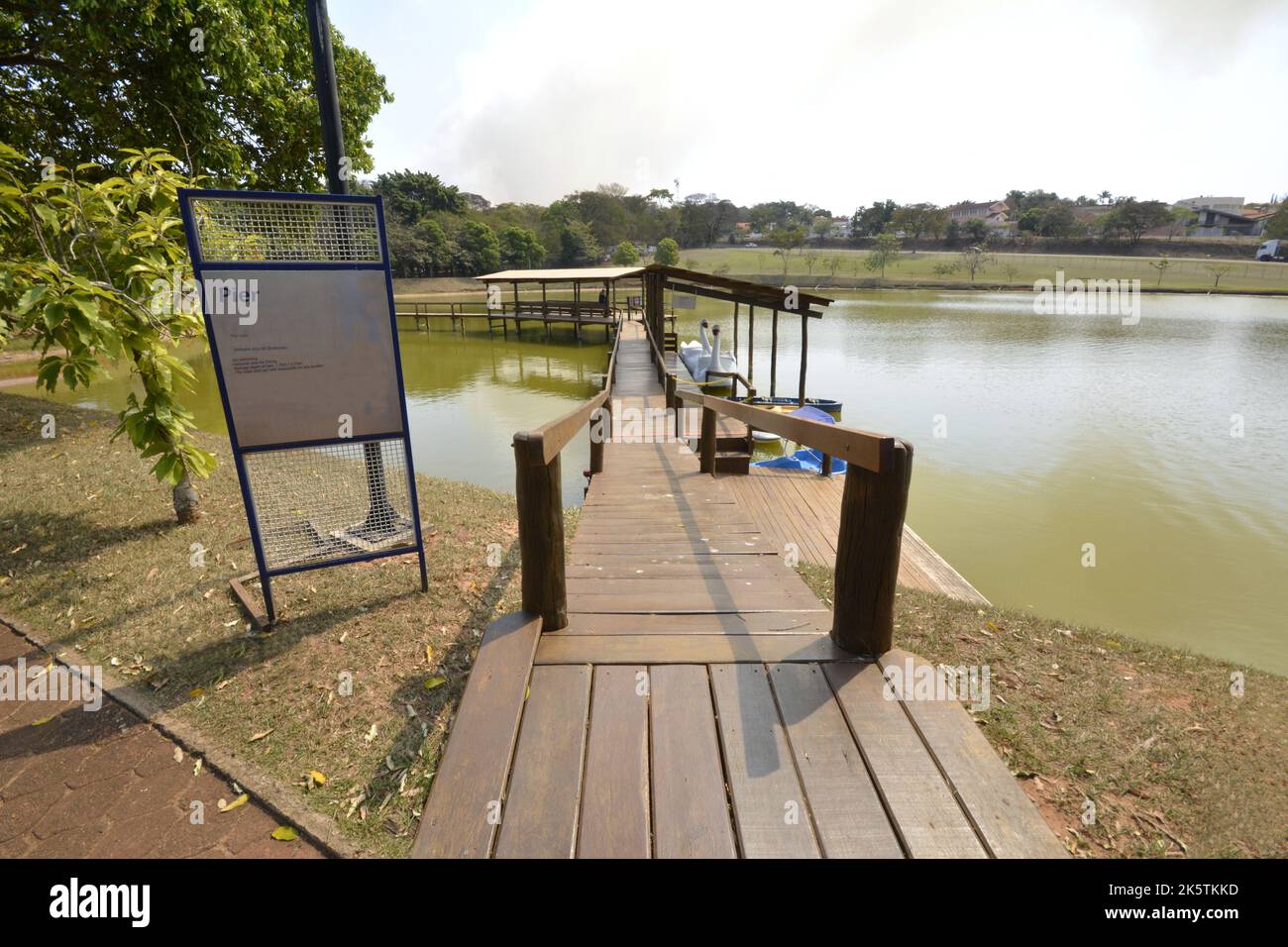 Natural lake with bridge to access the pier used for sport fishing and ...