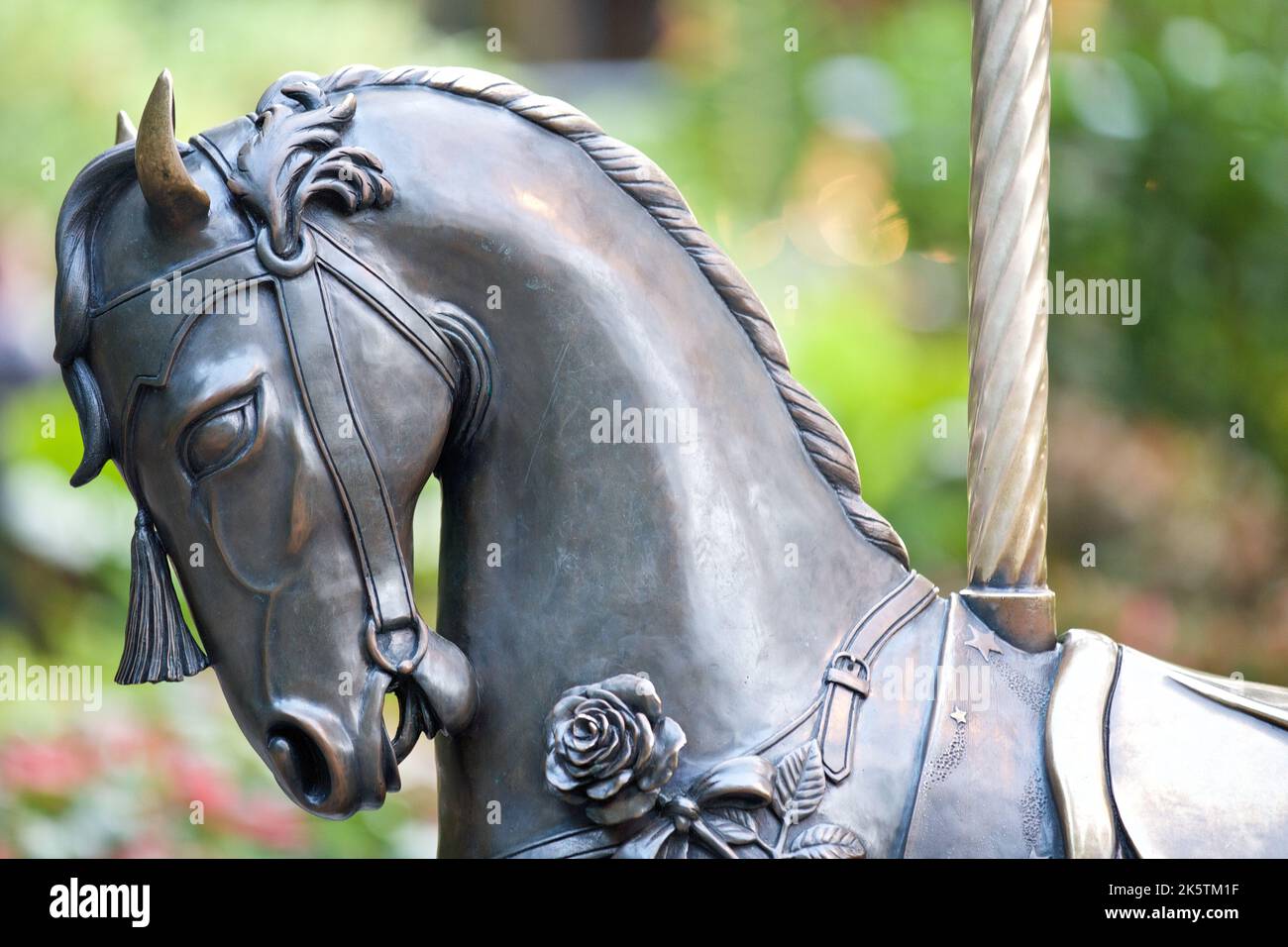 A closeup of a copper horse of a carousel in the Butchart Gardens ...