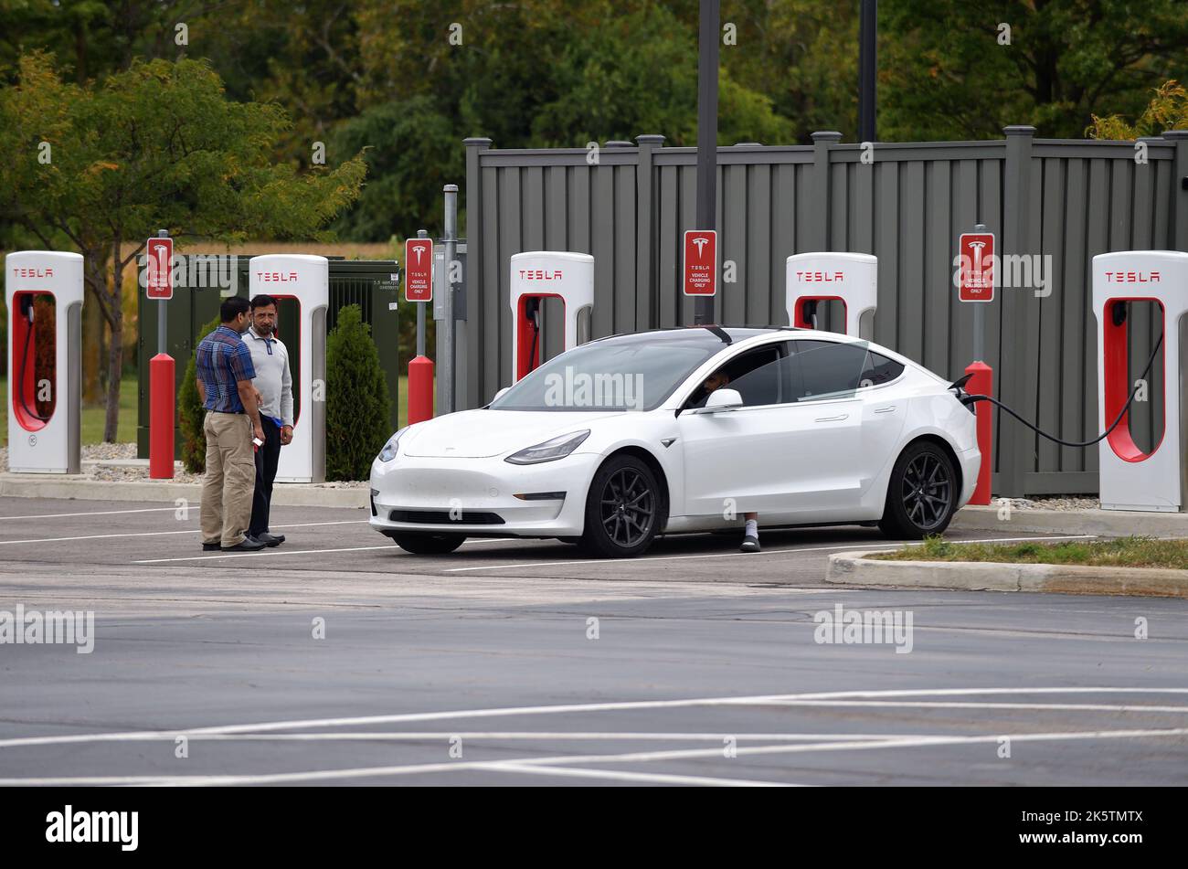 Genoa, Ohio, USA. A Tesla car being recharged at a Tesla electric ...