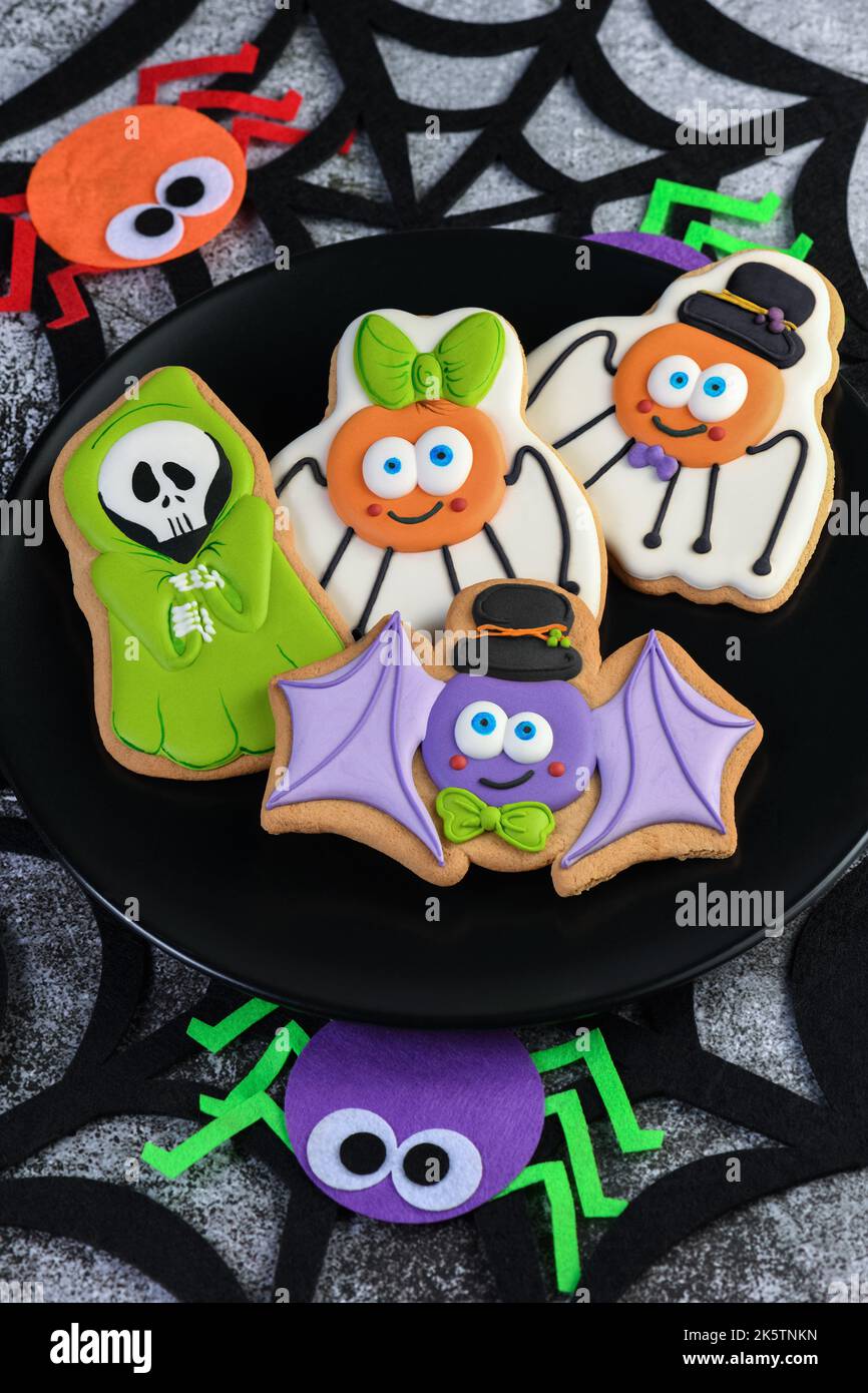 Happy Halloween with funny characters on gingerbread cookies; bat ...