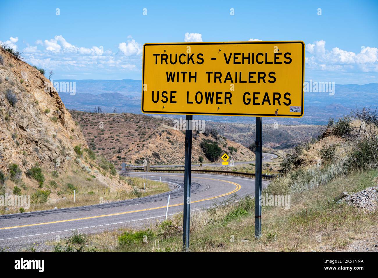 A cautionary sign for trucks and vehicles with trailers to use lower ...