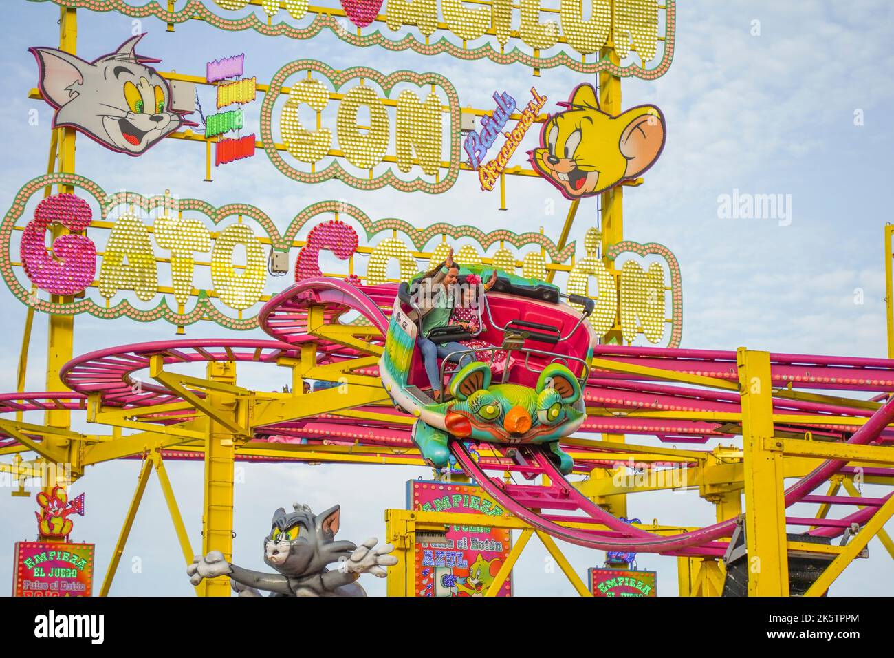 Man with little girl on highest point, scared in Roller coaster car ...