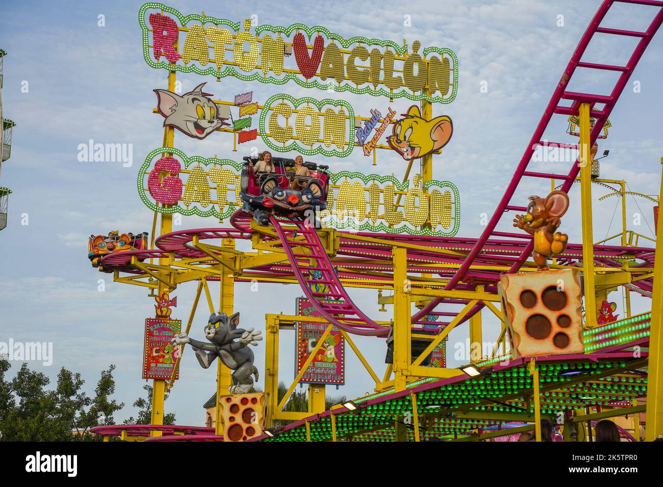 Two young women on highest point, scared in Roller coaster car ride on ...