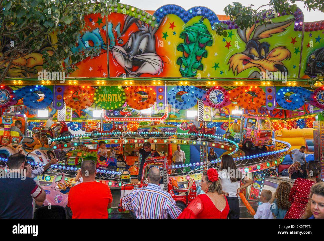 Litlle boy at amusement ride attractions on annual Feria. funfair ...