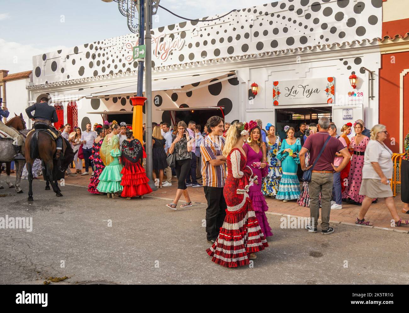 Spanish families, dressed traditionally celebrating at the annual fair ...