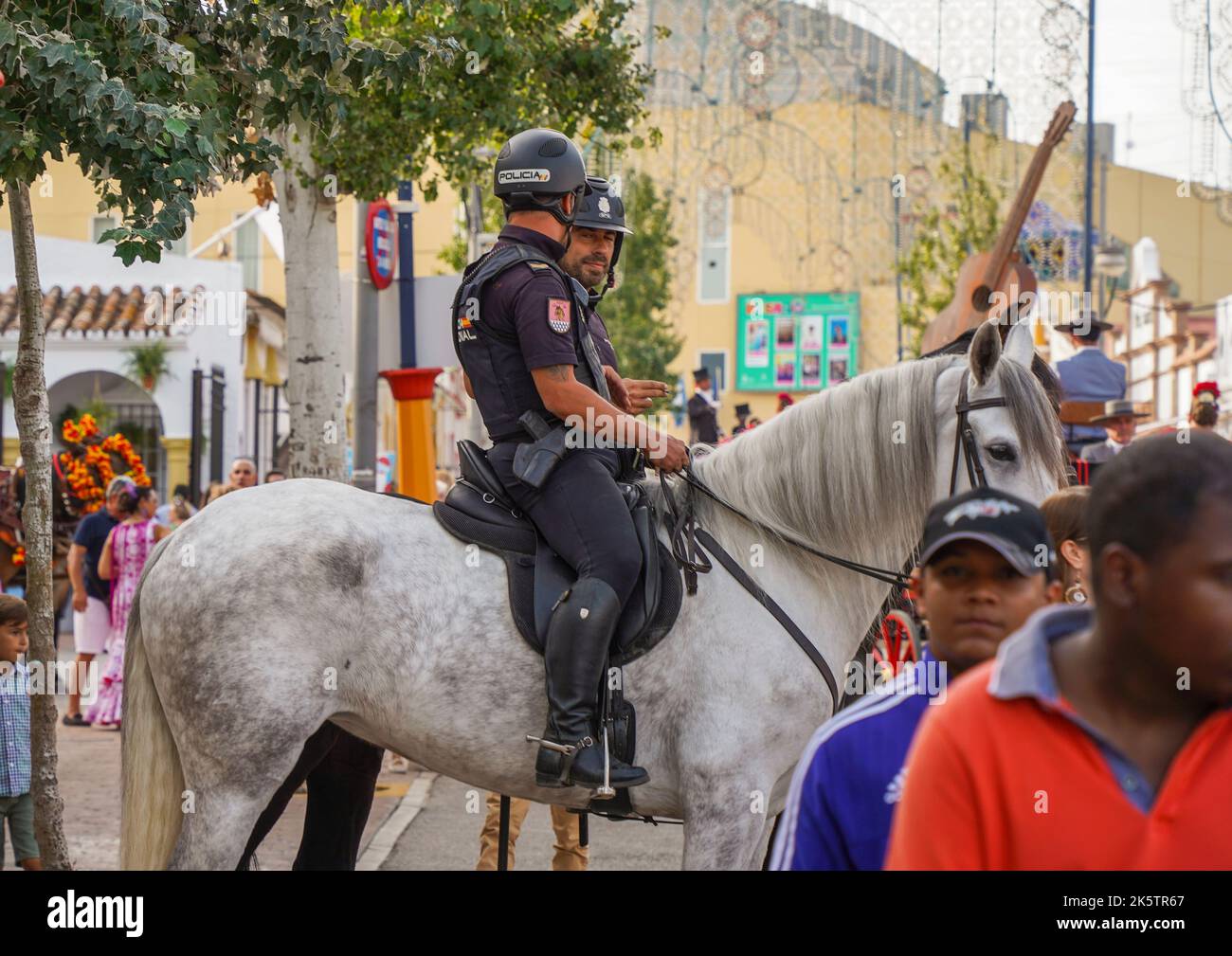 Spanish Mounted police on horses patrolling a celebration, Fuengirola ...