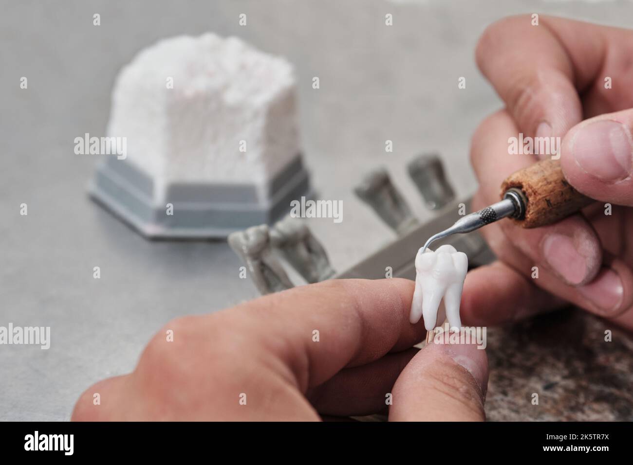 Dental technician dentist man working with dentures in his laboratory ...