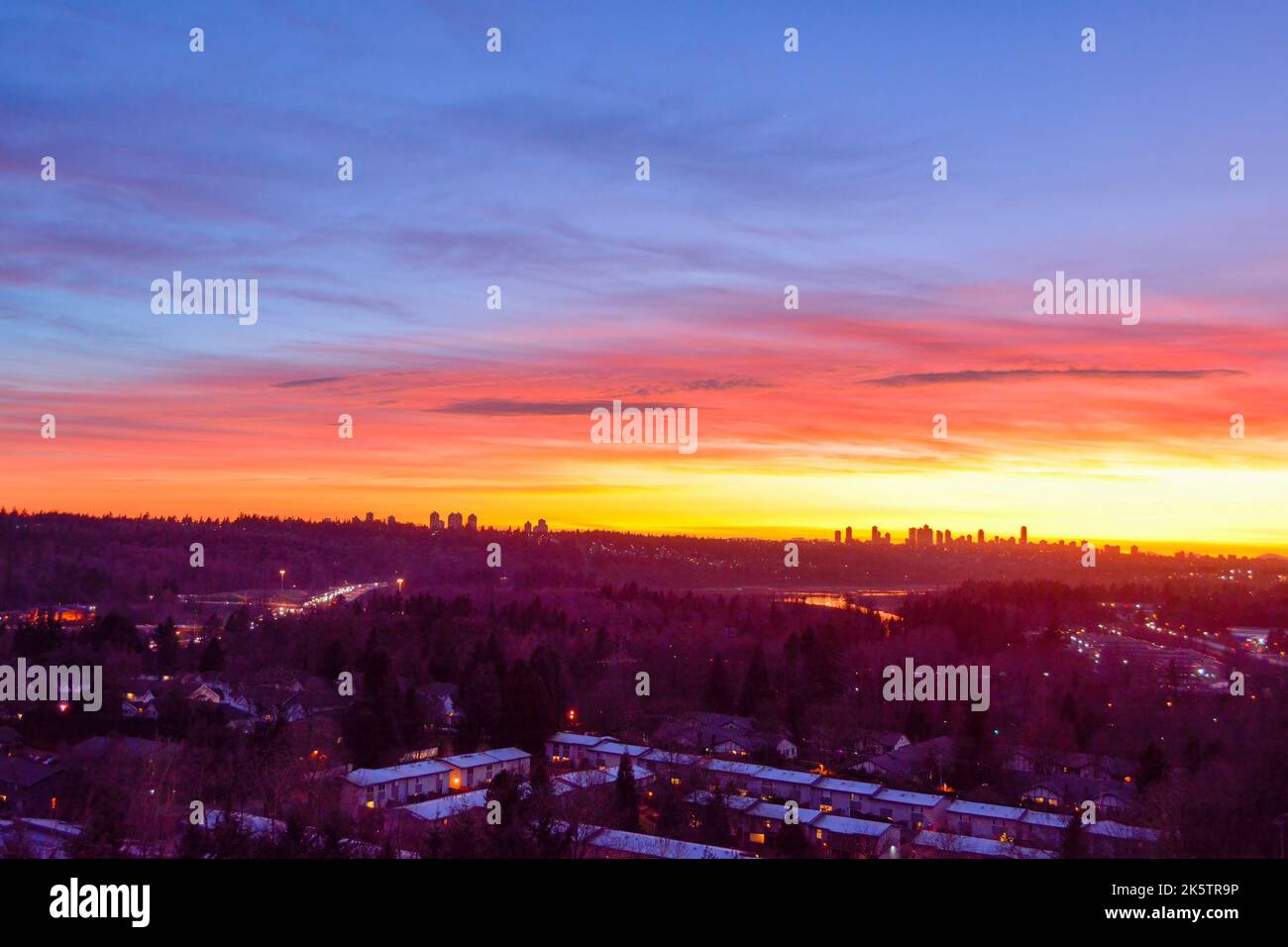 Suburban residential area on sunset sky background Stock Photo - Alamy