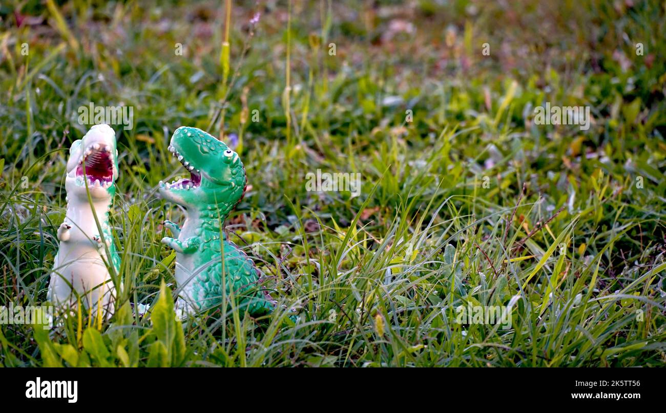 Plastic dinosaur toy pictured at a backyard Stock Photo - Alamy