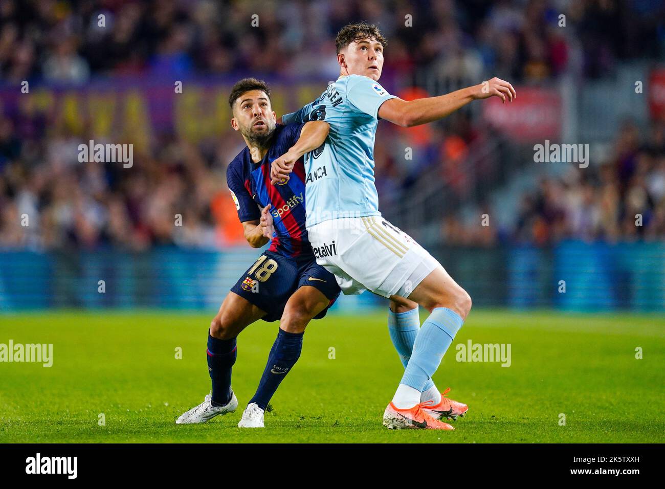 Jordi Alba of FC Barcelona and Jorgen Strand Larsen of RC Celta during ...
