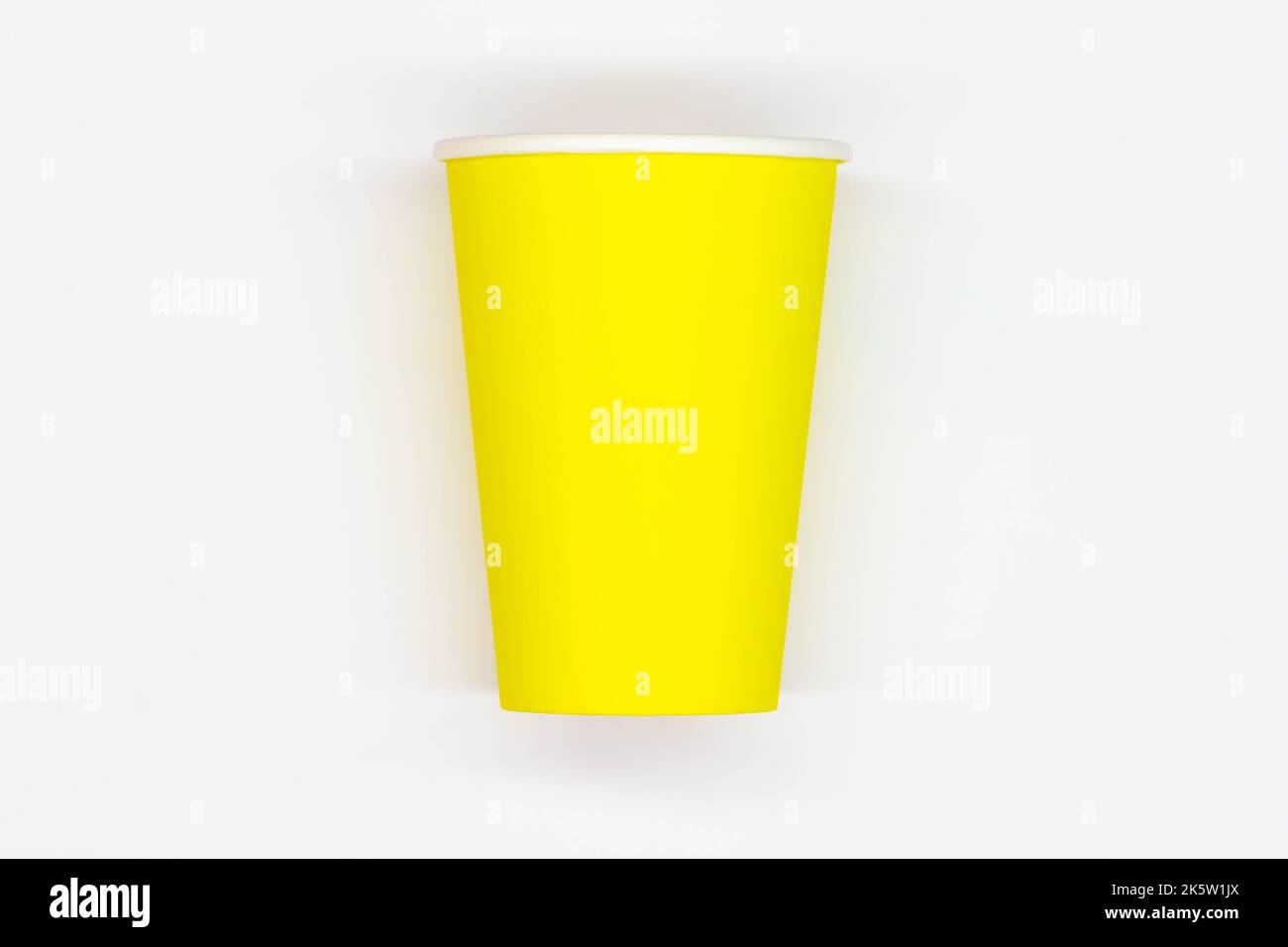 Paper coffee cup. Yellow craft paper coffee cup without lid. Disposable ...