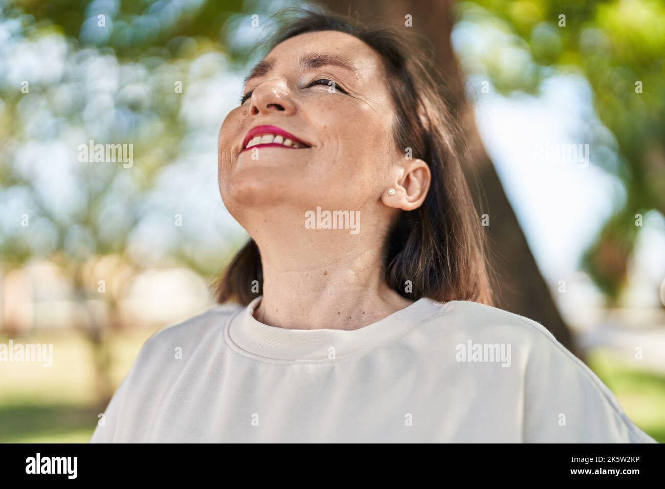 Cheerful mature woman breathing hi-res stock photography and images - Alamy