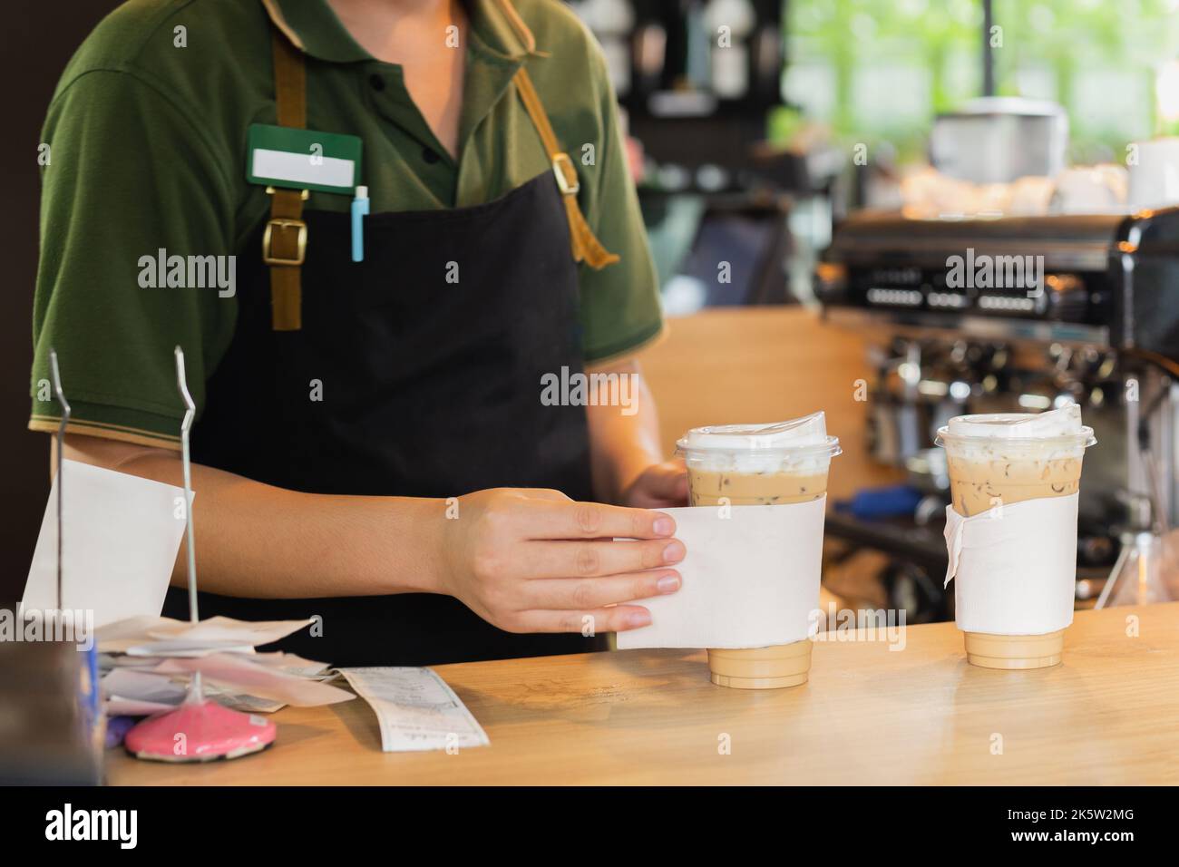 Barista serving ice coffee to customer in cafe coffee shop Stock Photo ...