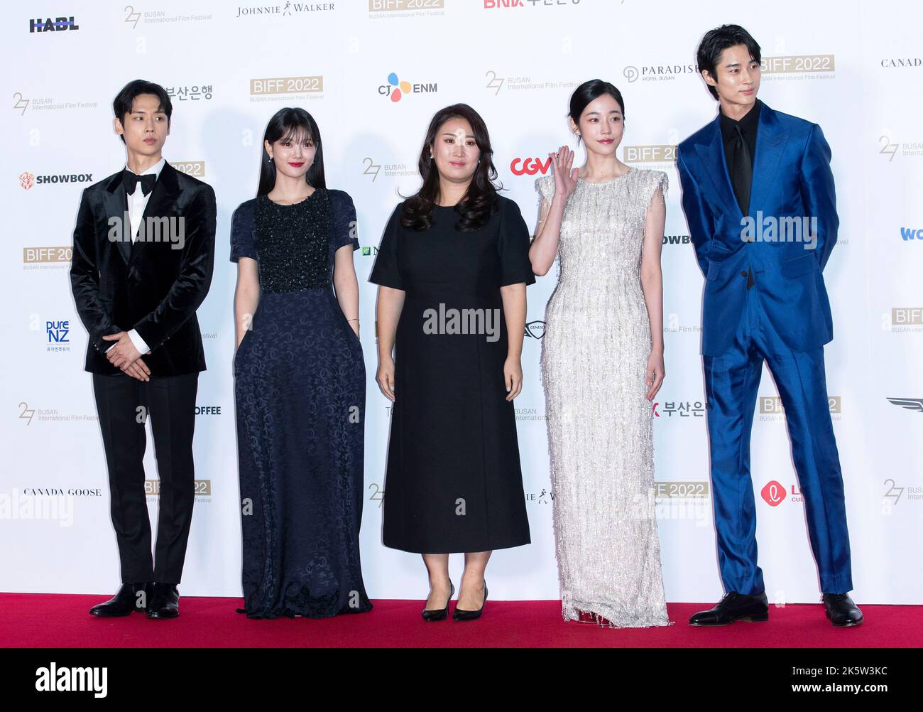5 October 2022 - Busan, South Korea : (L to R) Actors Park Jung-woo, Kim Yoo-jung, film director ...