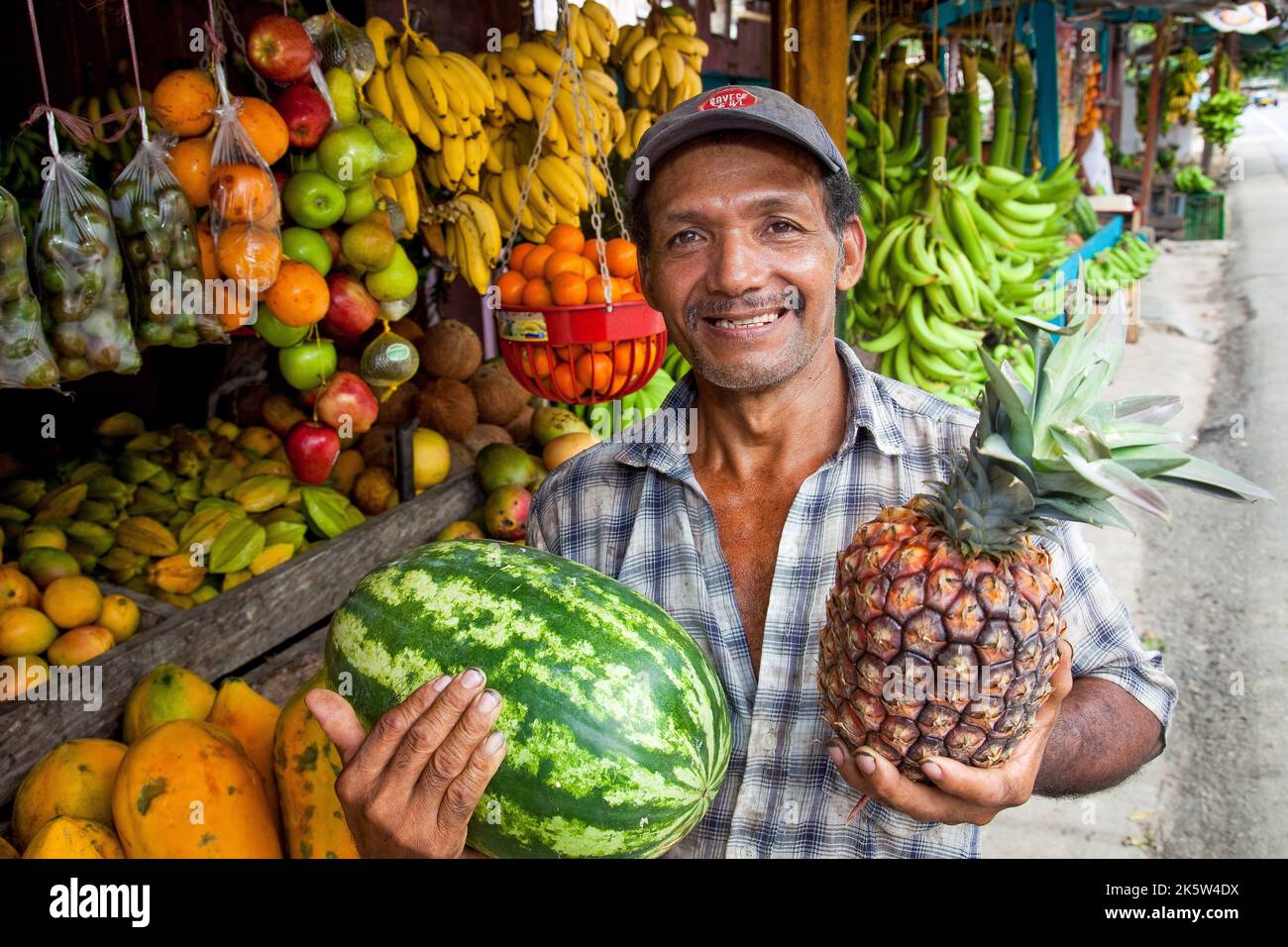 Colombia, Tayrona area, selling fruits besides the road along the ...