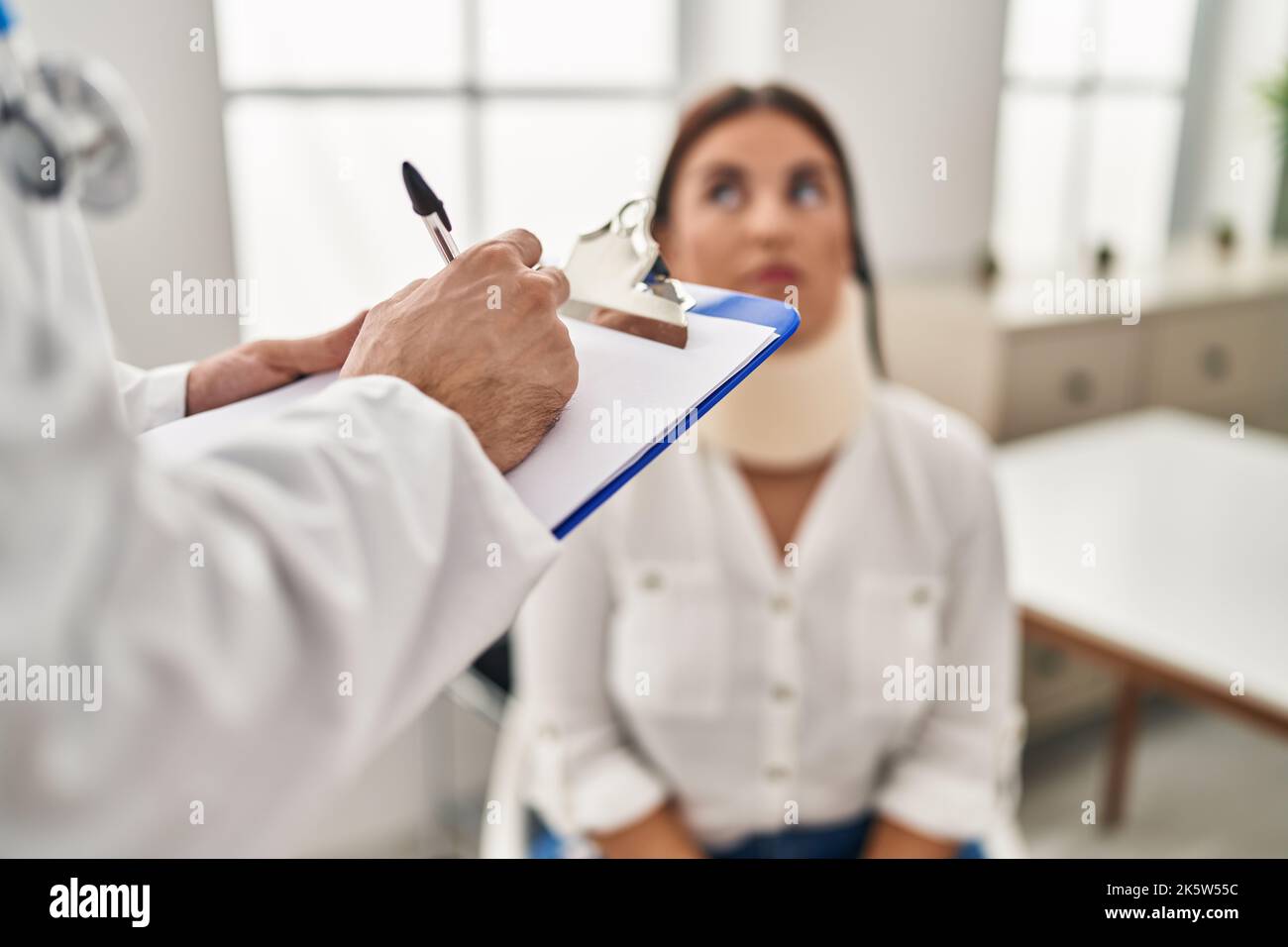 Man and woman doctor and patient having medical consultation for ...