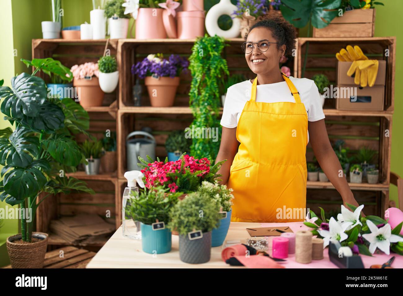 African american woman florist smiling confident standing at flower ...