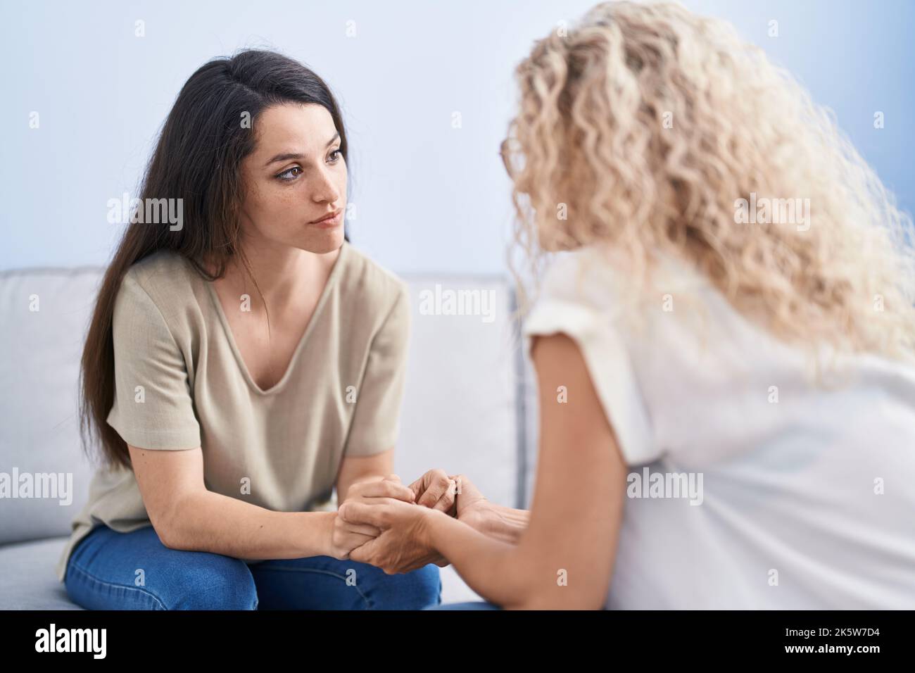 Two women mother and daughter speaking at home Stock Photo - Alamy