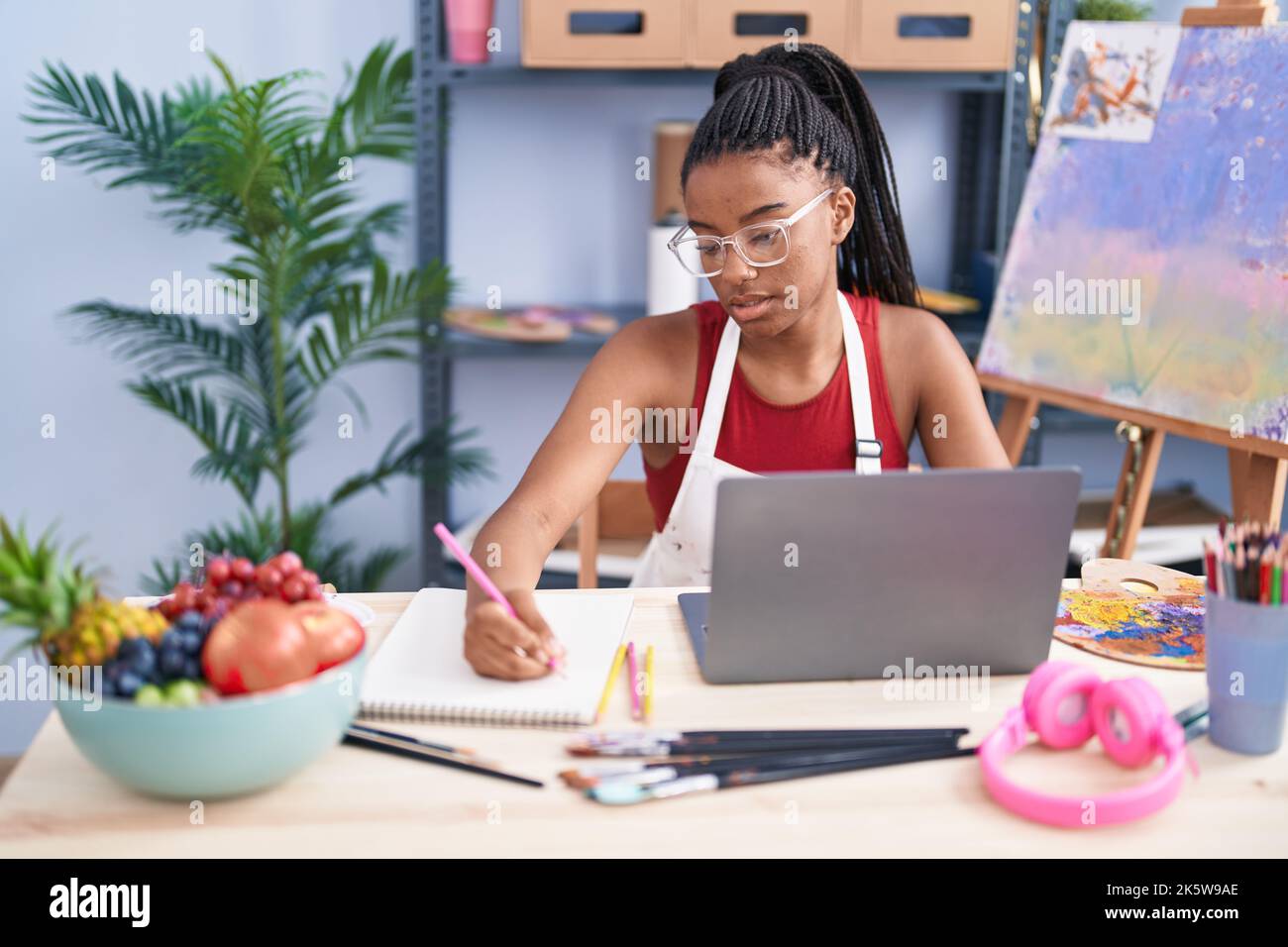 African american woman artist having online draw lesson at art studio ...