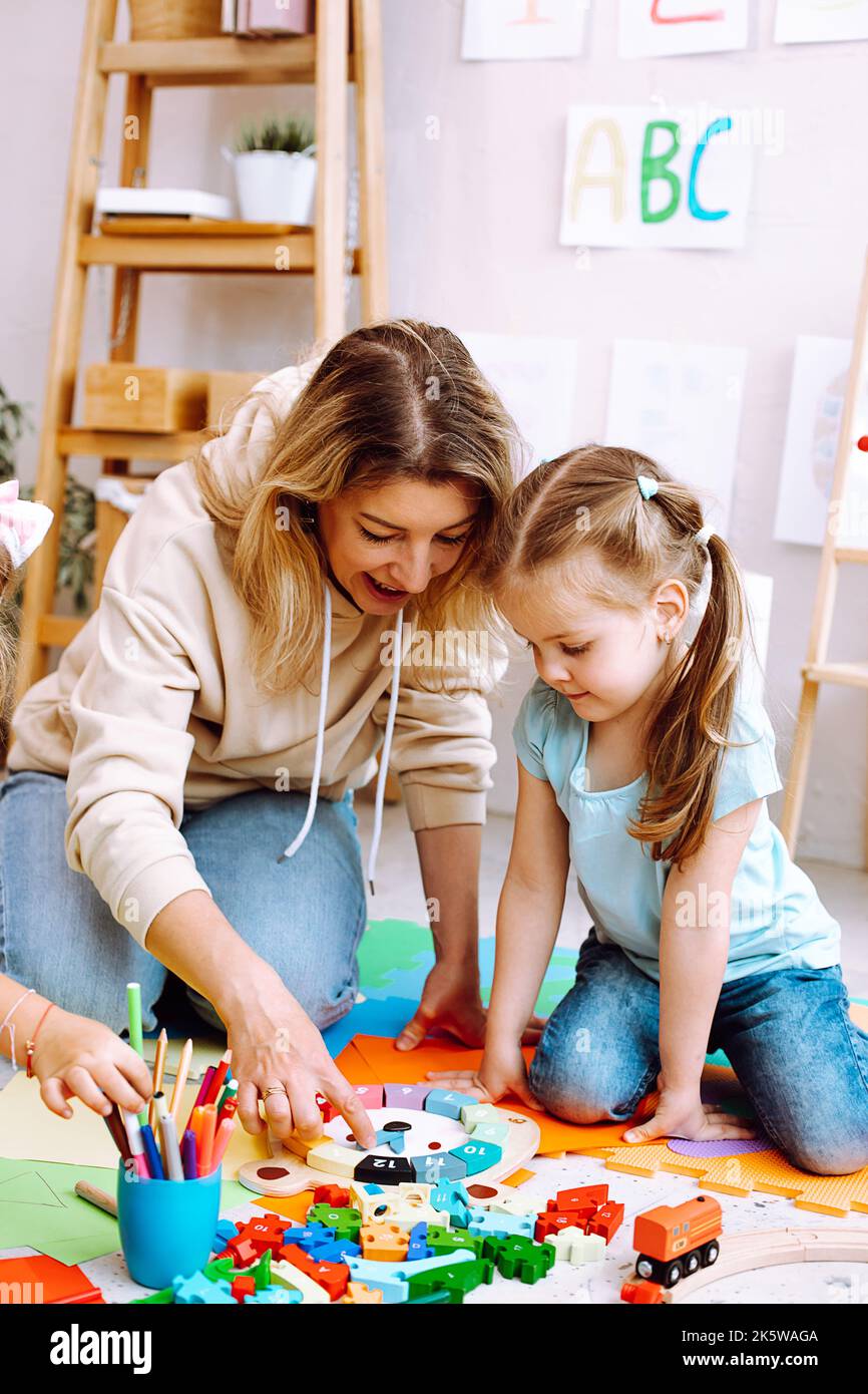 Vertical dedicated, rewarding female teacher play logic games and learn ...