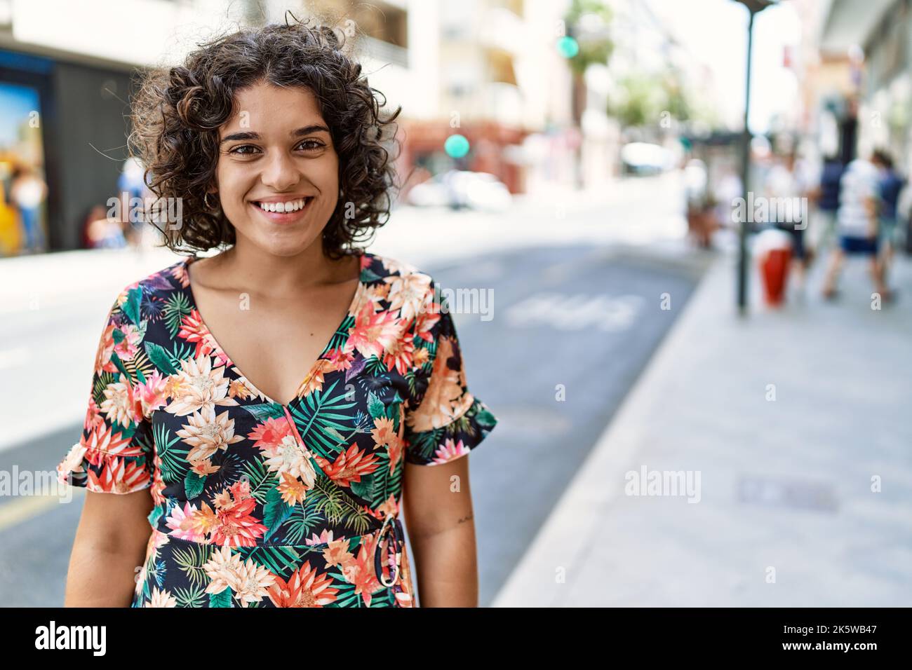 Young latin girl smiling happy standing at the city Stock Photo - Alamy