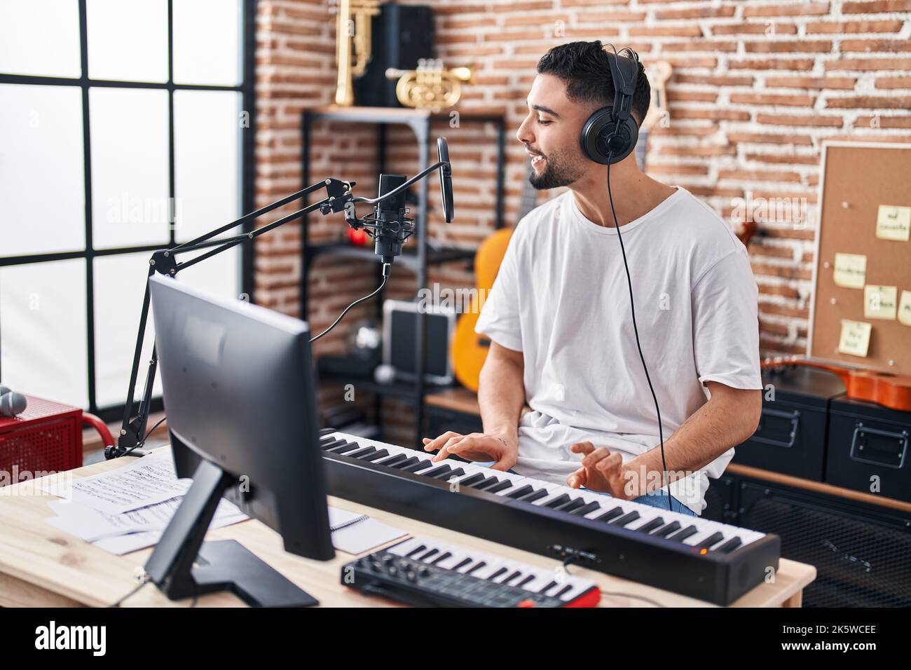 Arab male playing piano hi-res stock photography and images - Alamy