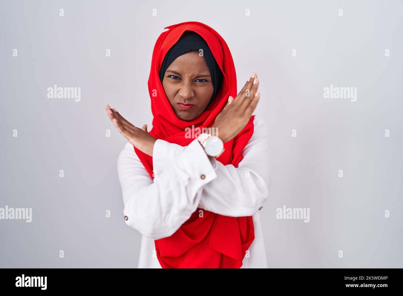 Young arab woman wearing traditional islamic hijab scarf rejection ...
