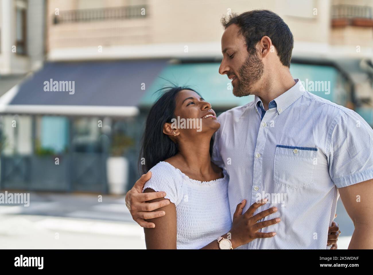 Man And Woman Interracial Couple Hugging Each Other At Street Stock