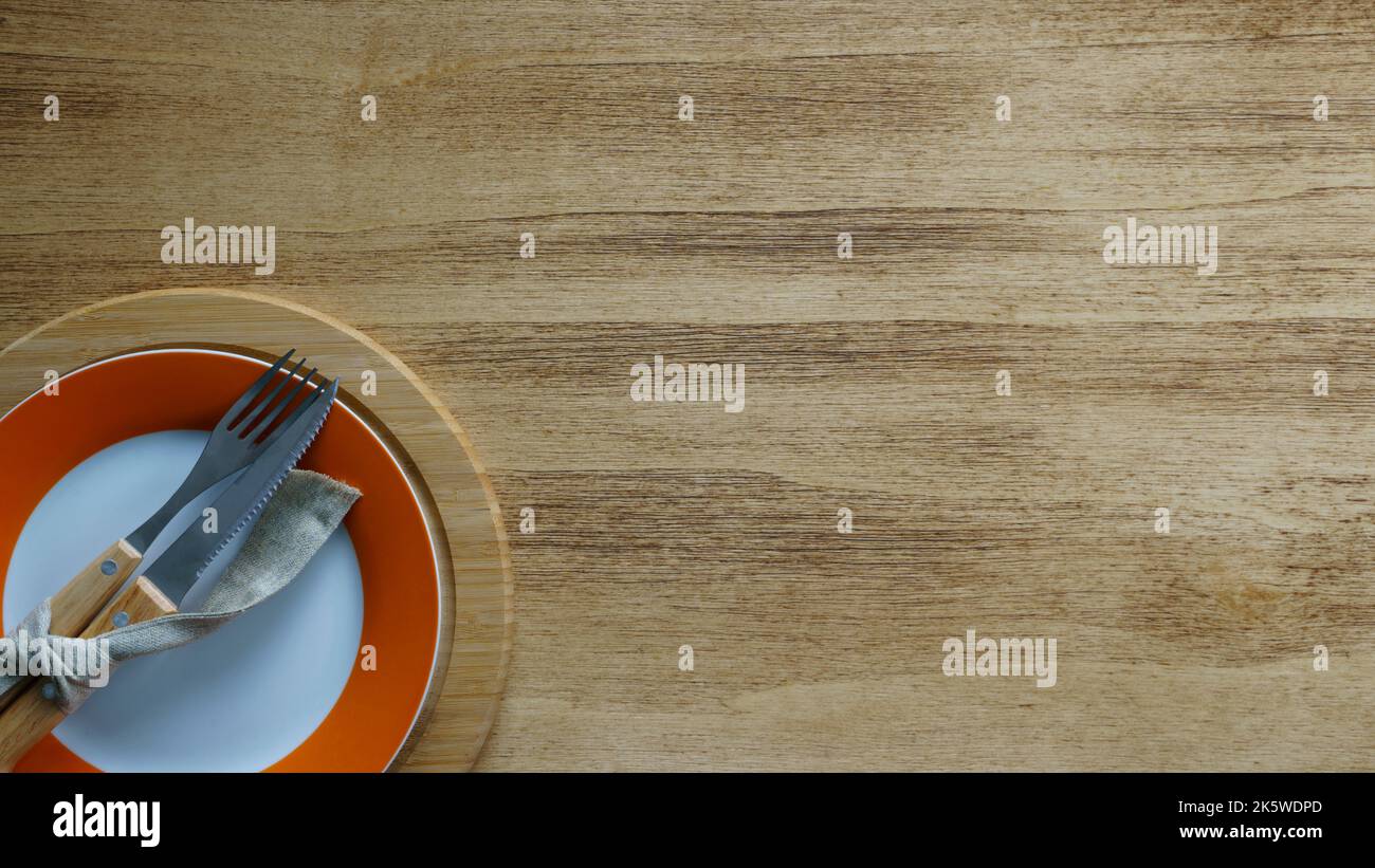 Empty plate with cutlery on rustic empty table, copy space, rim on ...