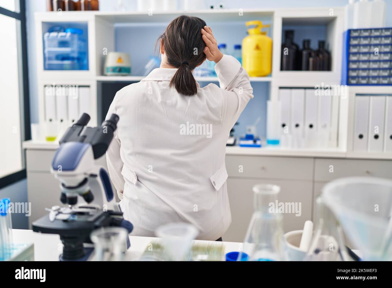 Back view female scientist working hi-res stock photography and images ...