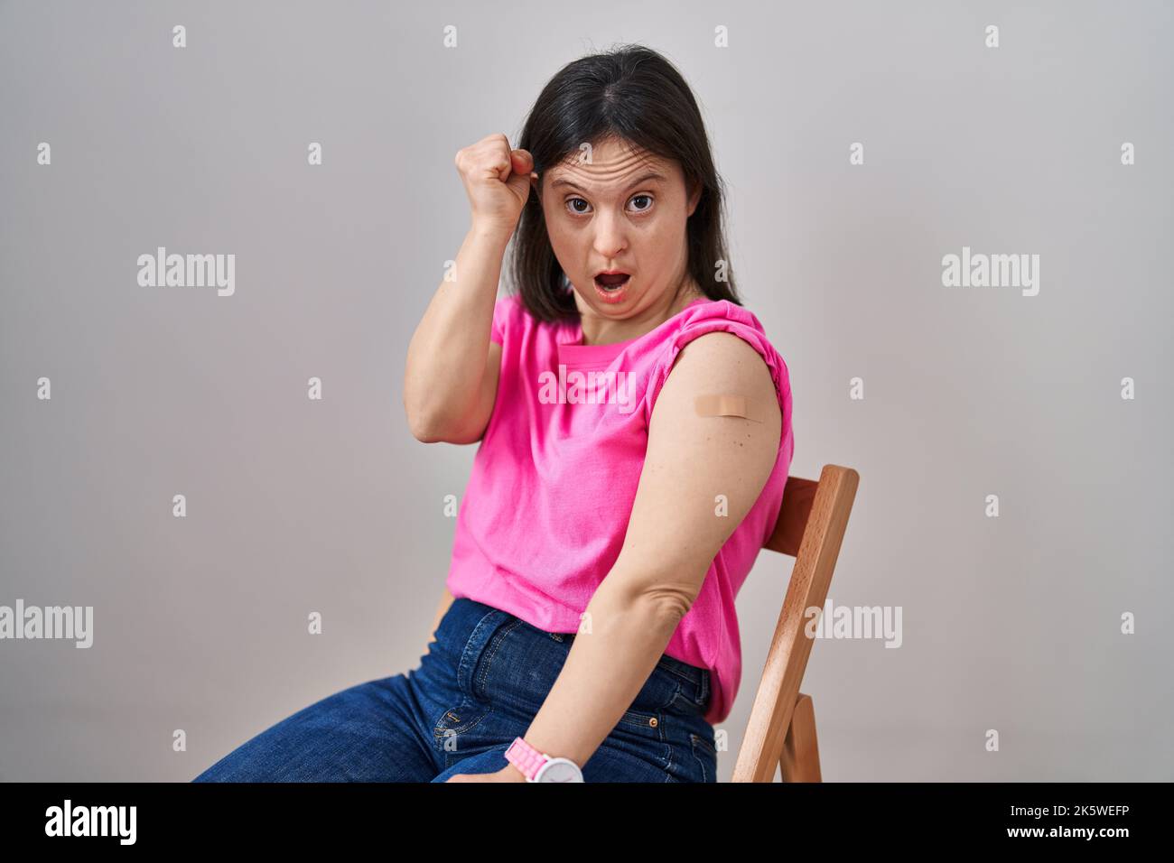 Woman with down syndrome wearing band aid for vaccine injection annoyed ...