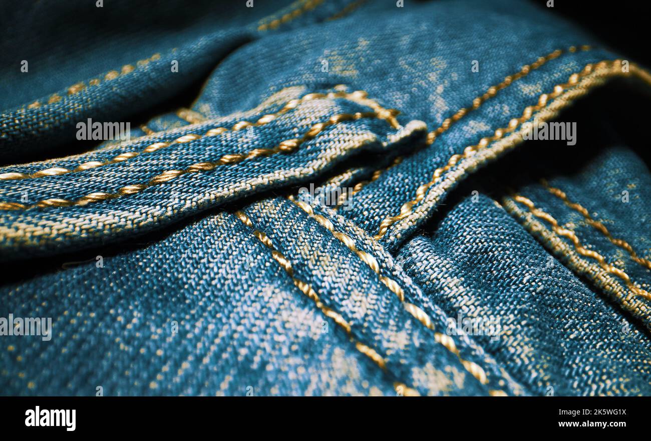 Denim blue jeans fabric texture. Close-up Stock Photo - Alamy