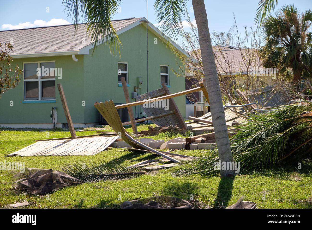 Home yard with scattered debris after hurricane Ian in Florida ...