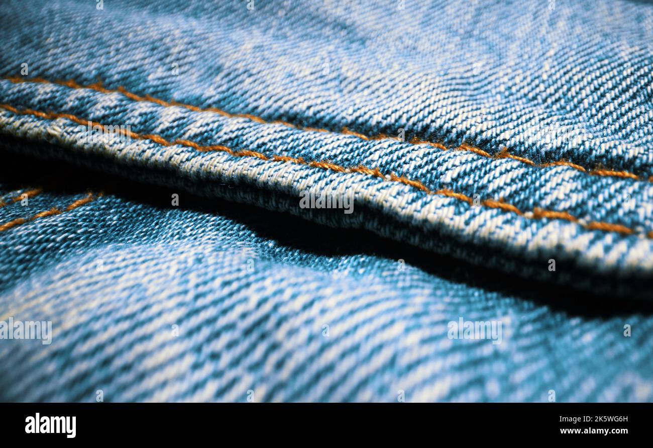 Denim blue jeans fabric texture. Close-up Stock Photo - Alamy