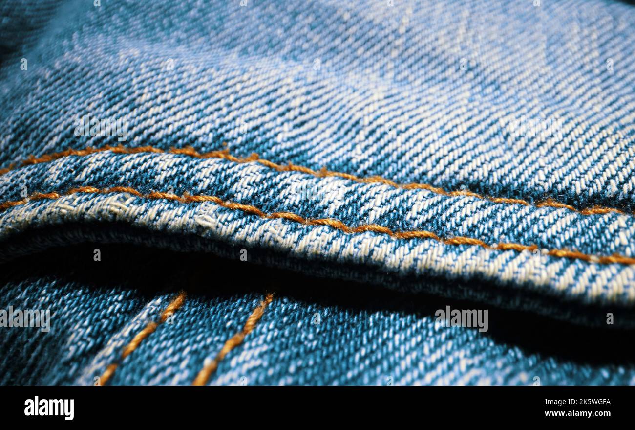 Denim blue jeans fabric texture. Close-up Stock Photo - Alamy