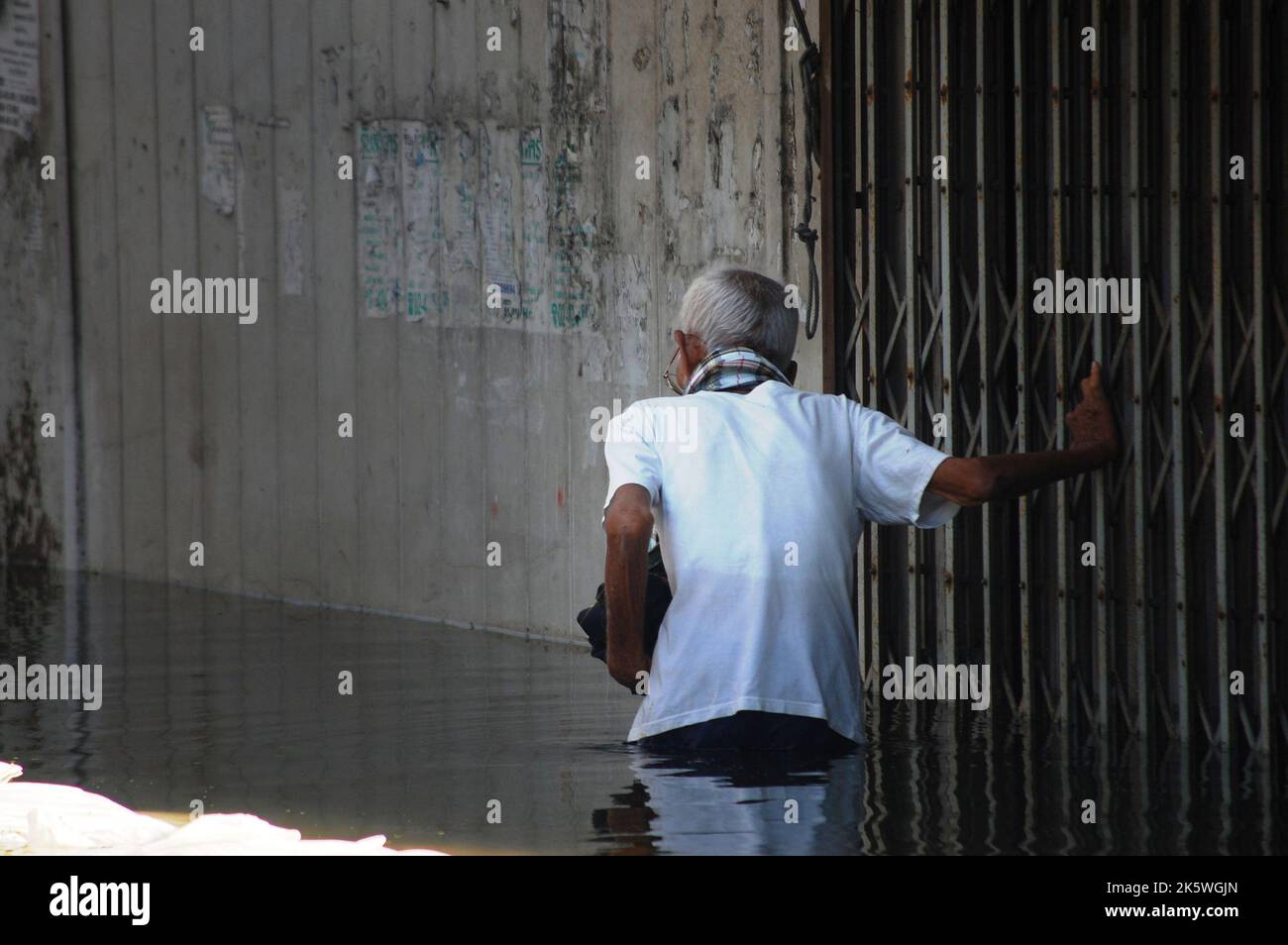 Thai old men people natural disaster victims walking wading in water on ...