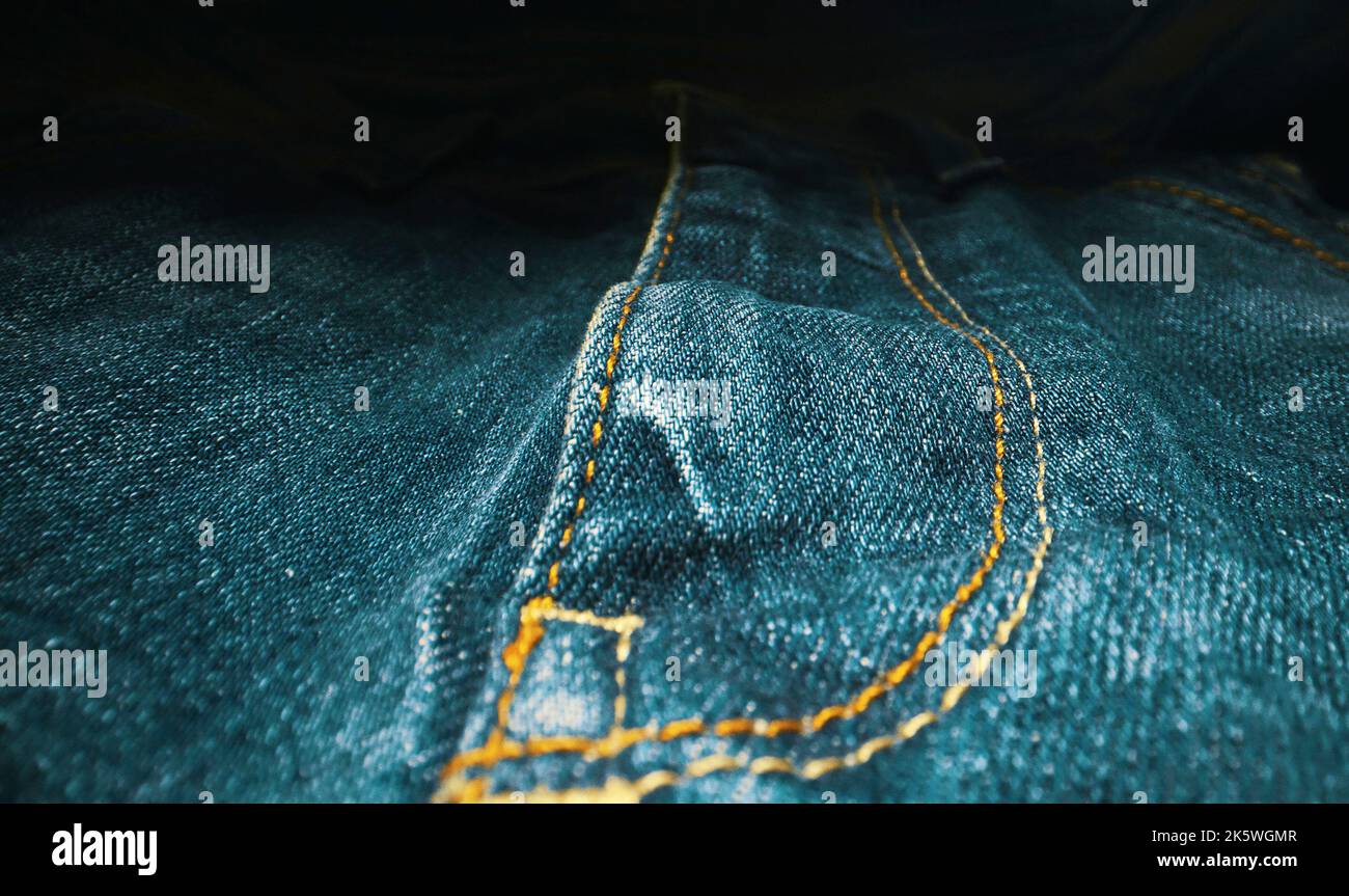 Denim blue jeans fabric texture. Close-up Stock Photo - Alamy