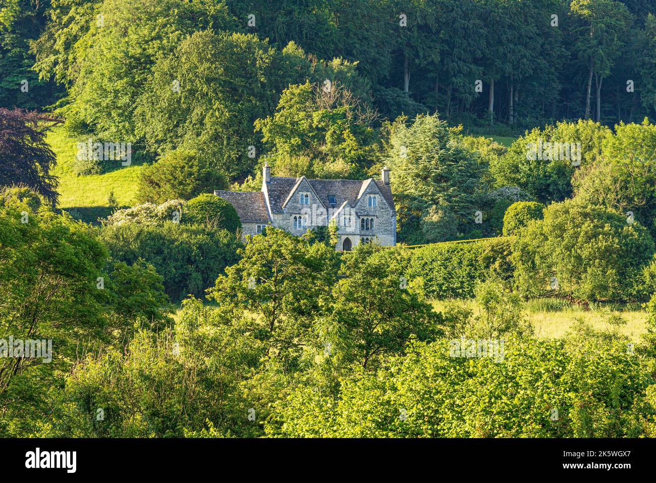 Early morning light on Midsummers Day (June 21st) on 17th century Abbey ...
