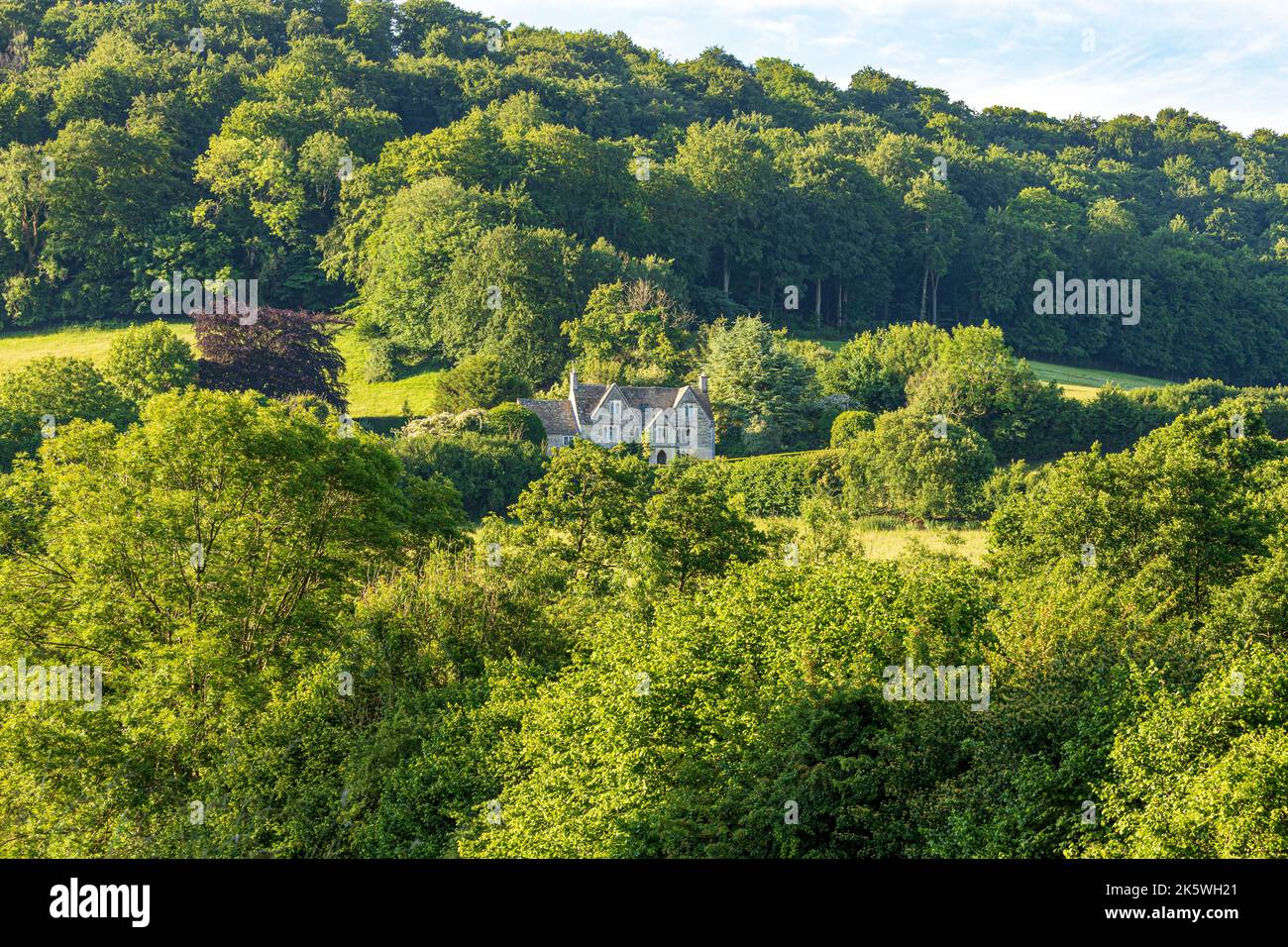 Early morning light on Midsummers Day (June 21st) on 17th century Abbey ...