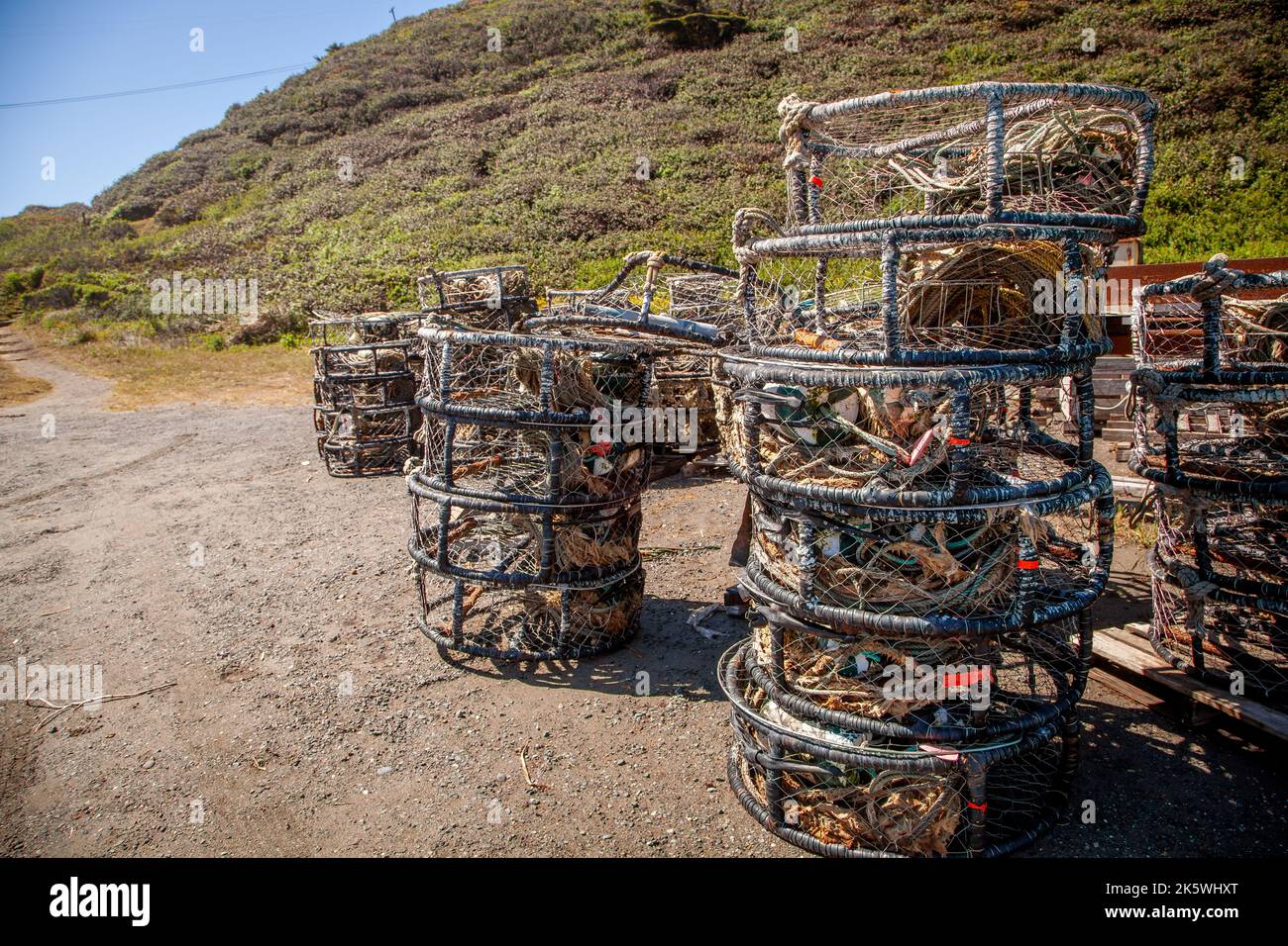 Crab traps on shore stacked and ready to go out crabbing Stock Photo ...