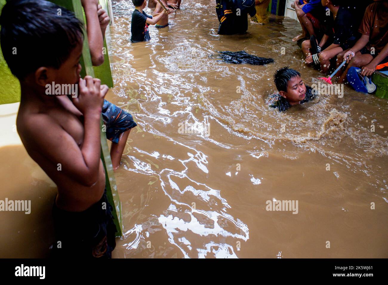 Jakarta, Indonesia. 10th Oct, 2022. Kids seen playing into the water ...