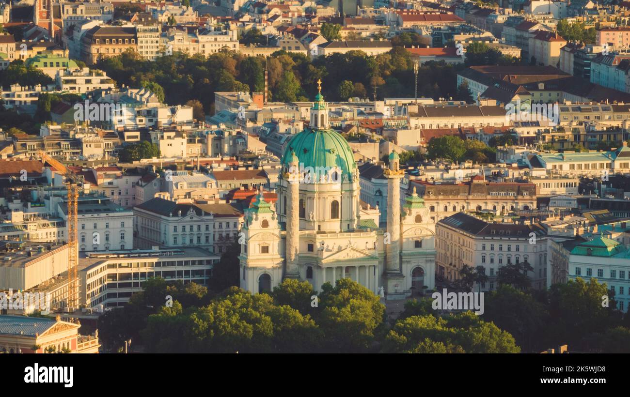 An aerial view of cityscape Vienna surrounded by buildings under blue ...