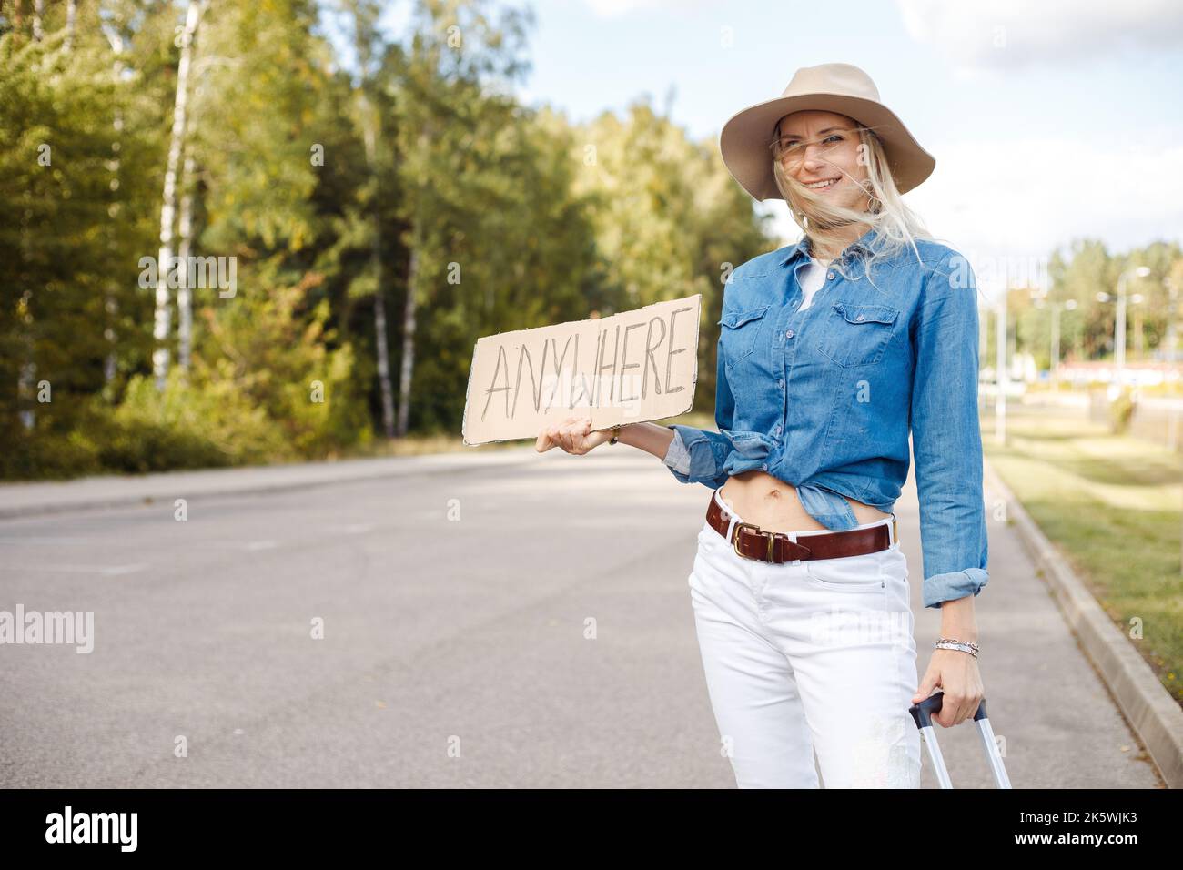 Young wonderful woman raising hand with cardboard with inscription ... Young wonderful woman raising hand with cardboard with inscription ...