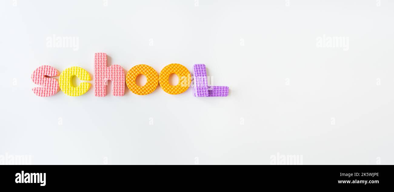 Banner with multi-colored letters. Letters for the study of children in ...