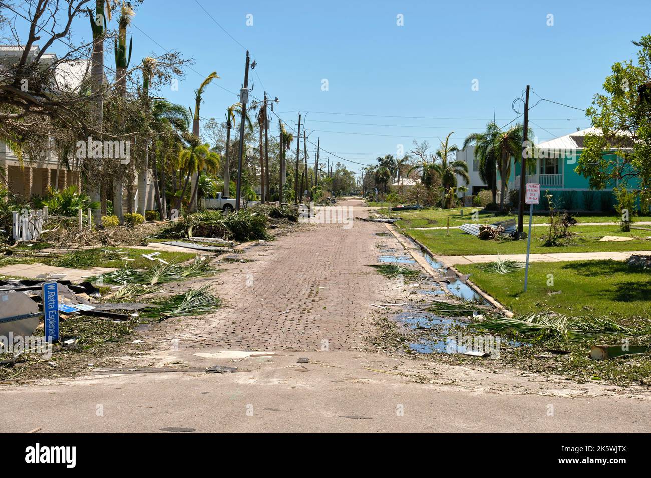 Town street with scattered debris after hurricane Ian in Florida ...