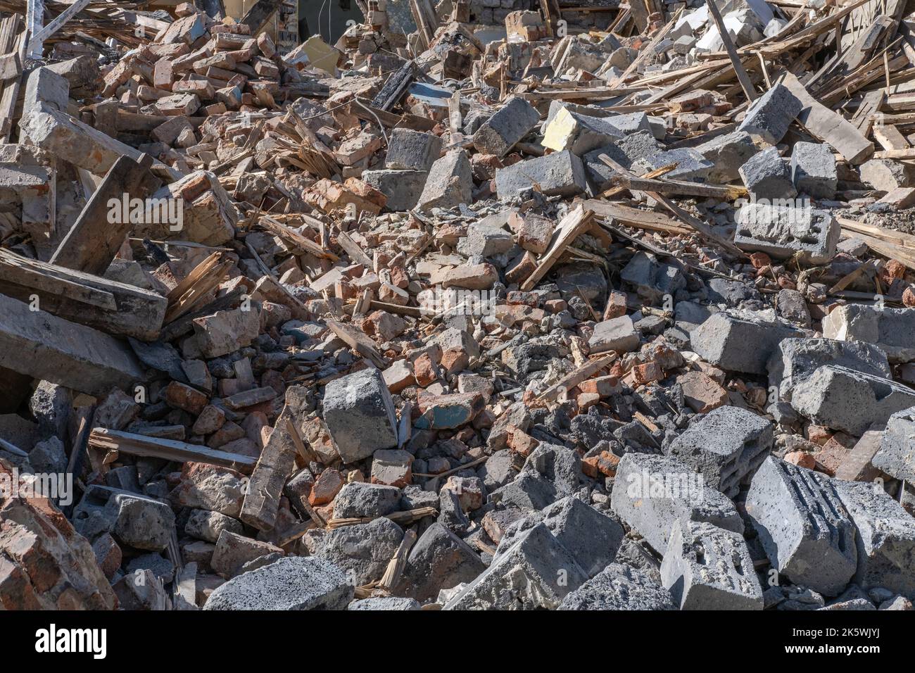 Garbage after the demolition of the building. Broken walls, windows ...