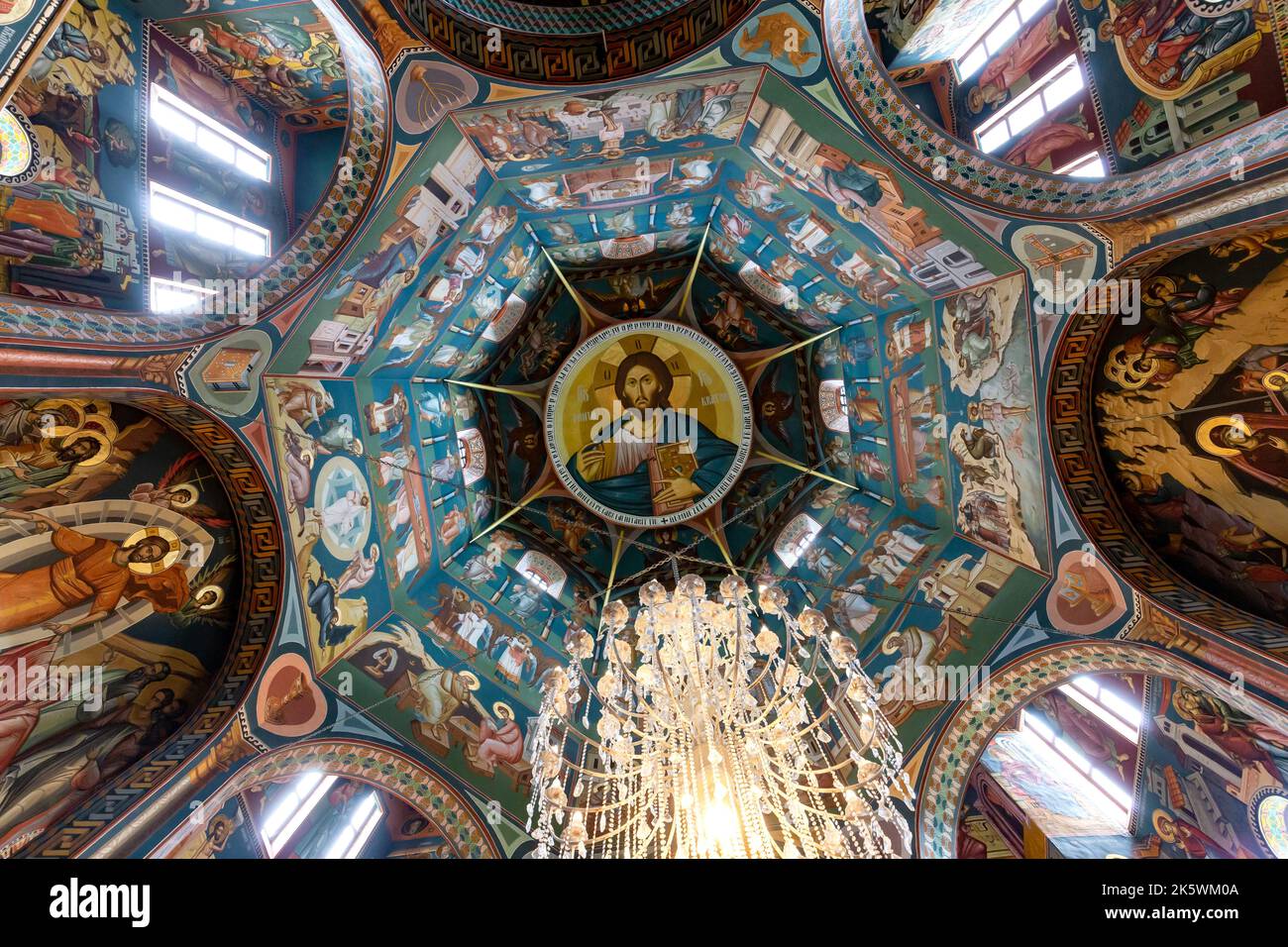 A low-angle view of the painting of Jesus Christ painted on the ceiling ...